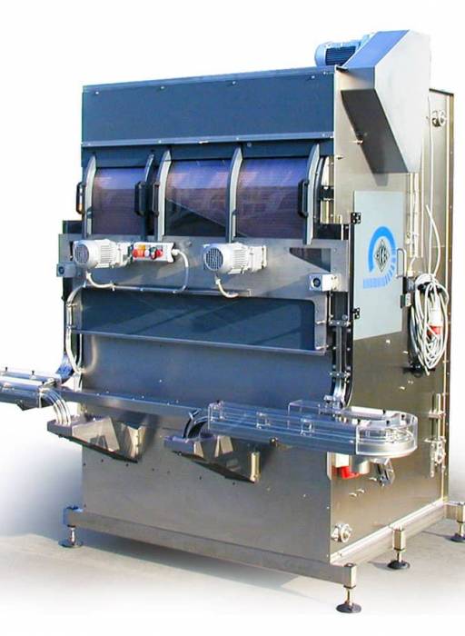 Machinery for sorting closure parts.